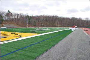 Controversial turf field gets final touches