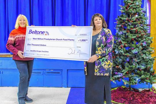 Beltone donates $1,000 to food pantry